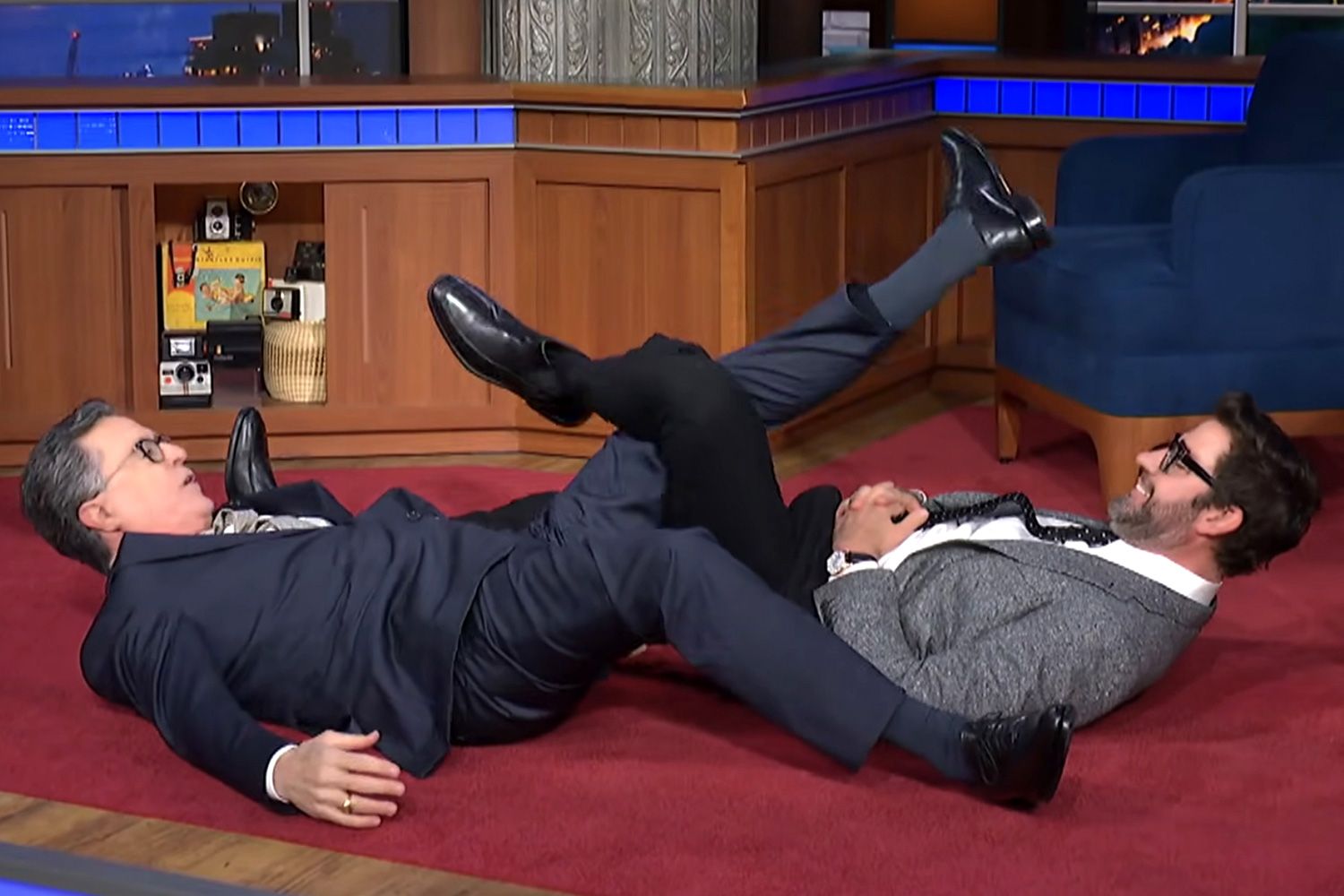 Stephen Colbert and John Krasinski take shots and then leg wrestle in ...