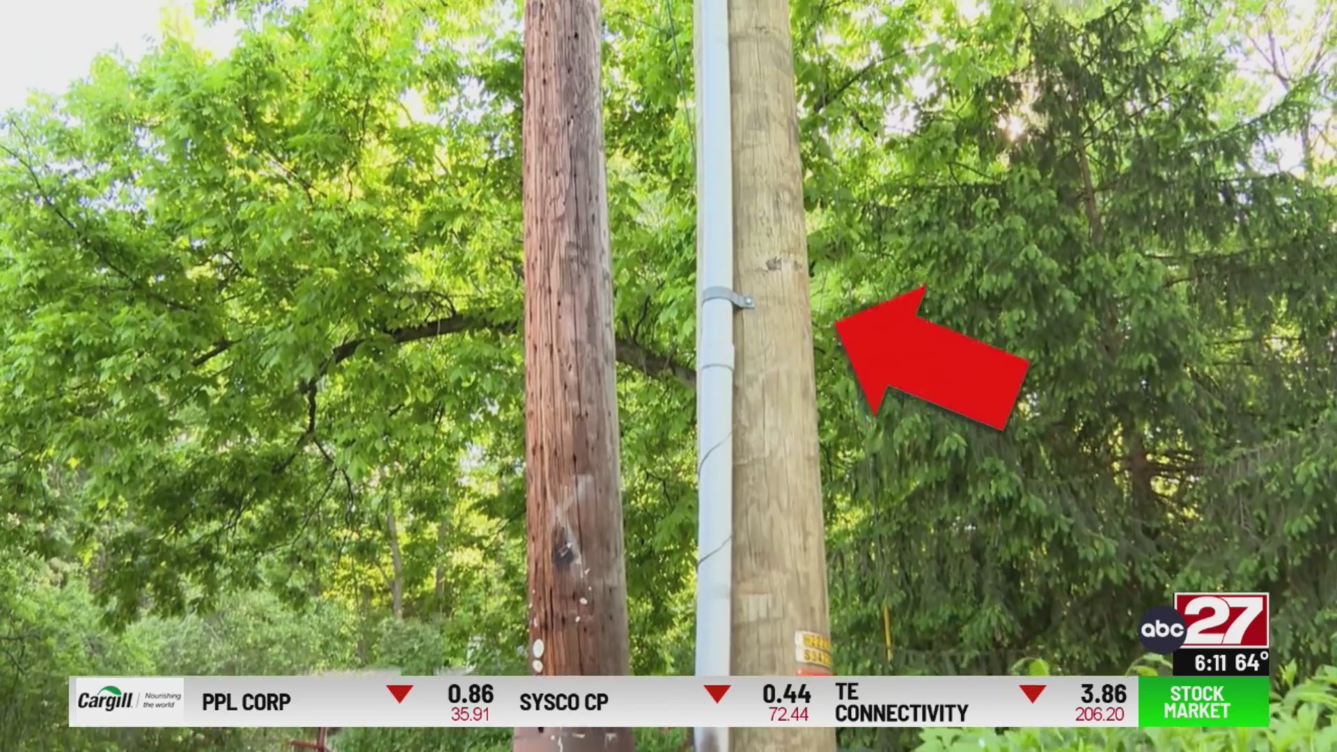 Utility companies string along community worried about fallen pole