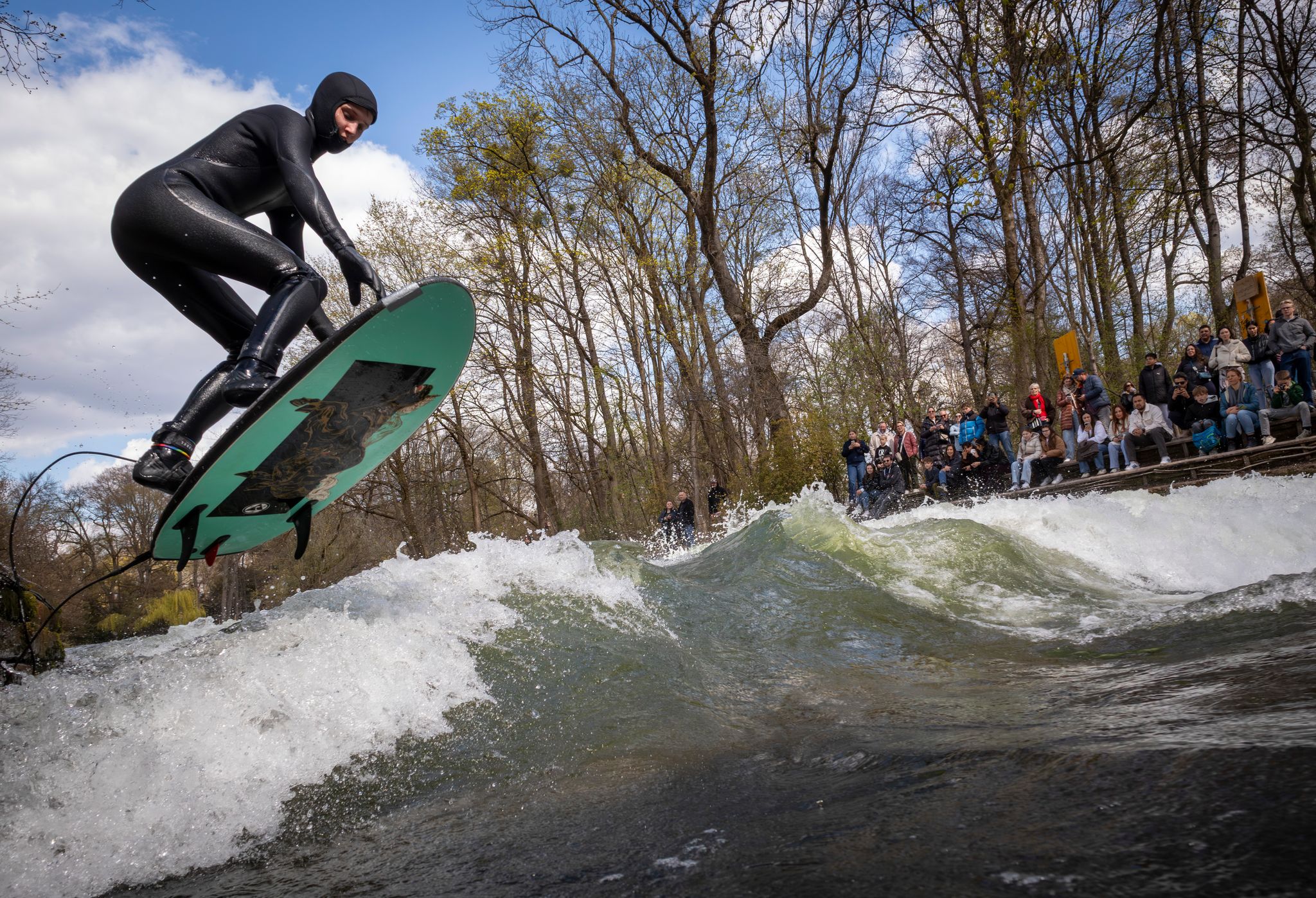 Munich surfers greet reopening of artificial wave in park