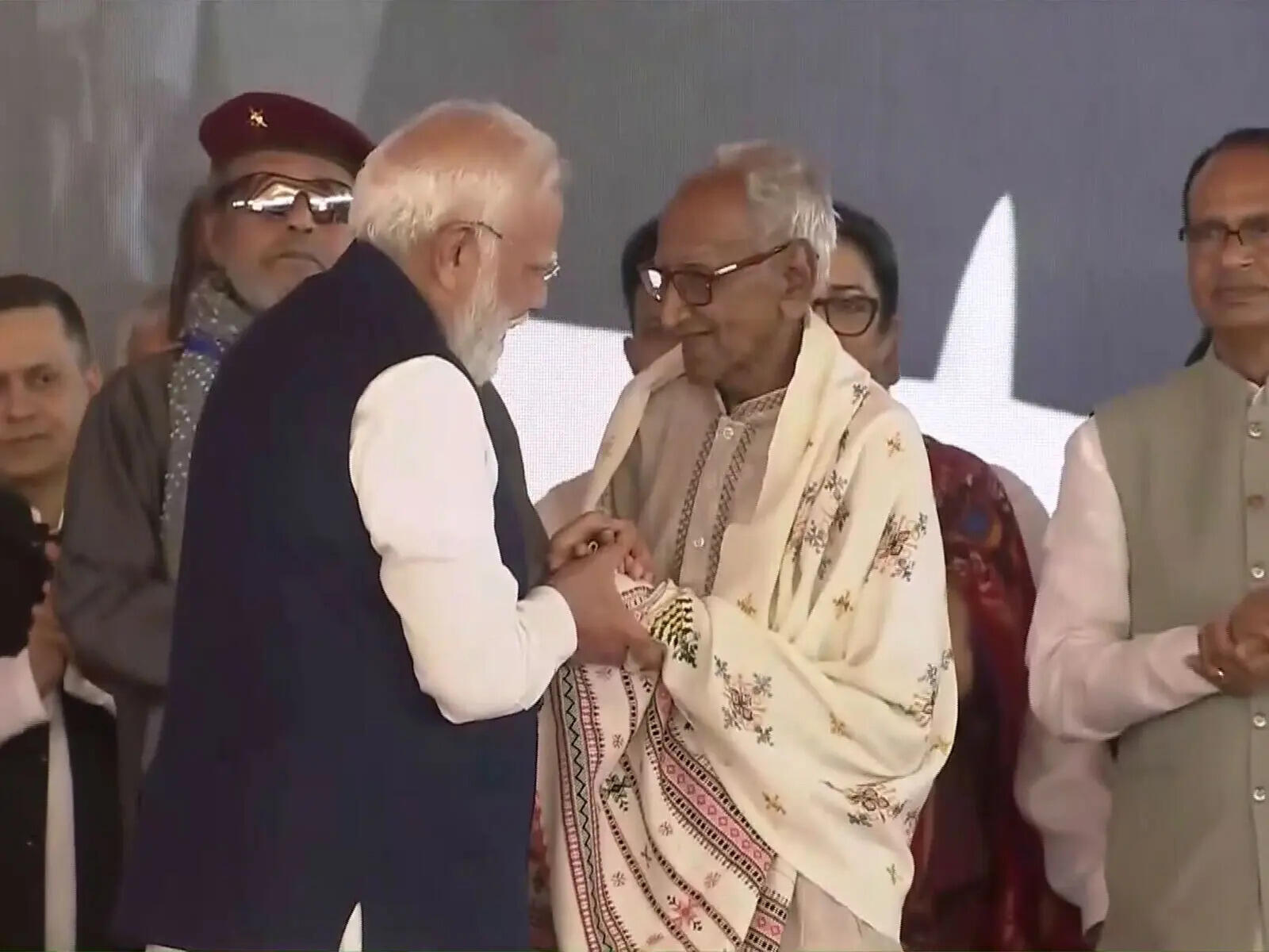 PM Modi felicitates BJP veteran worker Makhanlal Sarkar during swearing ...