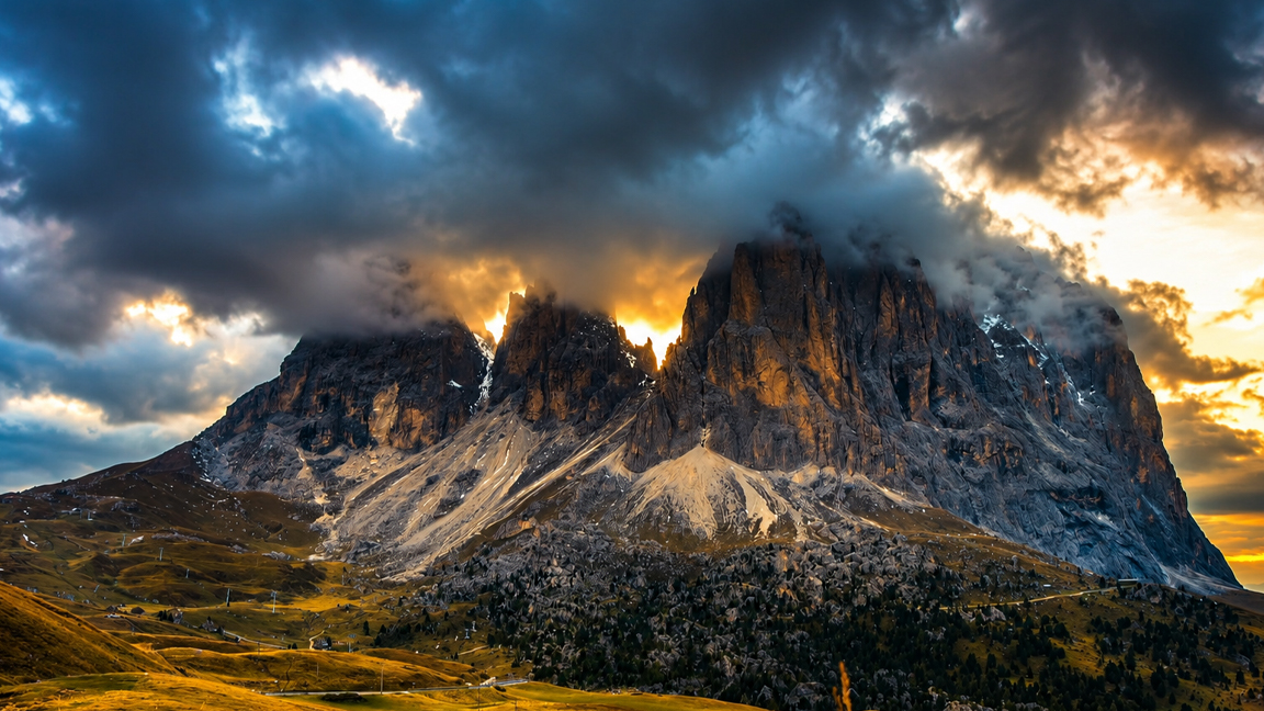 Stormy sunset over majestic mountain landscape
