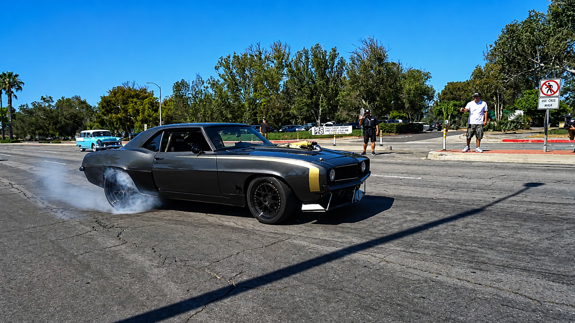 Vintage Chevrolet Camaro burnout turns into a wild launch on public road
