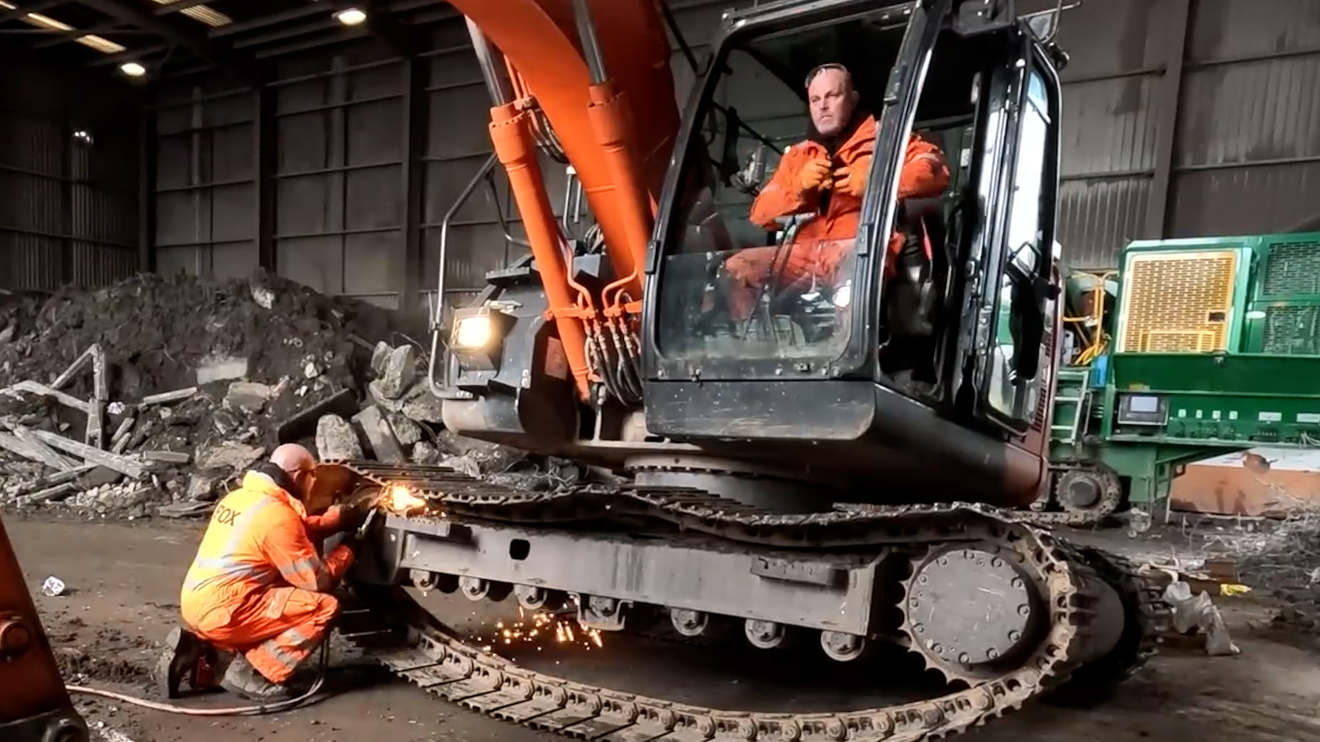 On-site excavator track repair inside an industrial facility
