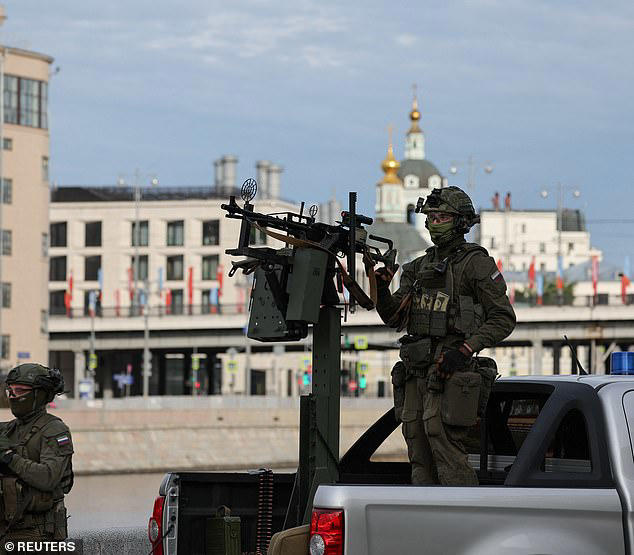 No tanks, we're at war! Putin oversees stripped-down Victory Day parade ...