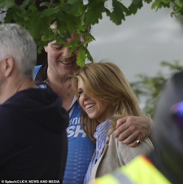 'Giddy' Garraway and her man in lycra! Kate and Liam Halligan can't ...