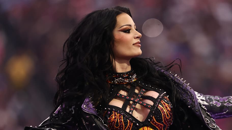 Paige shows off the damage after being busted open on WWE SmackDown