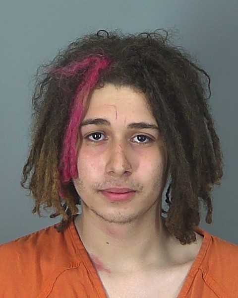 Two charged after body found in burning car on railroad tracks ...
