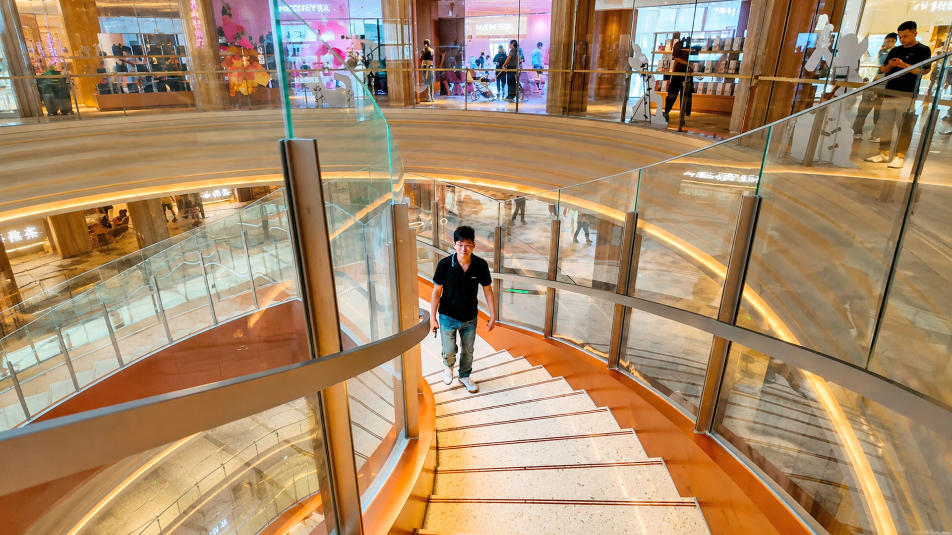 Inside China’s futuristic mall filled with curved glass staircases and ...