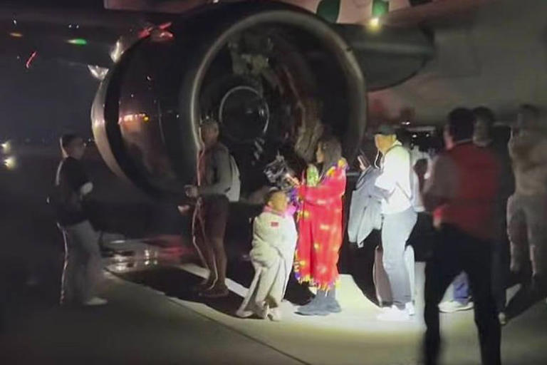 Terrified families flee on slides after plane engine 'partially ...
