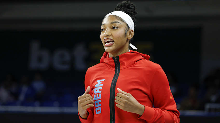Angel Reese struts in all-business skirt suit and heels for dream debut