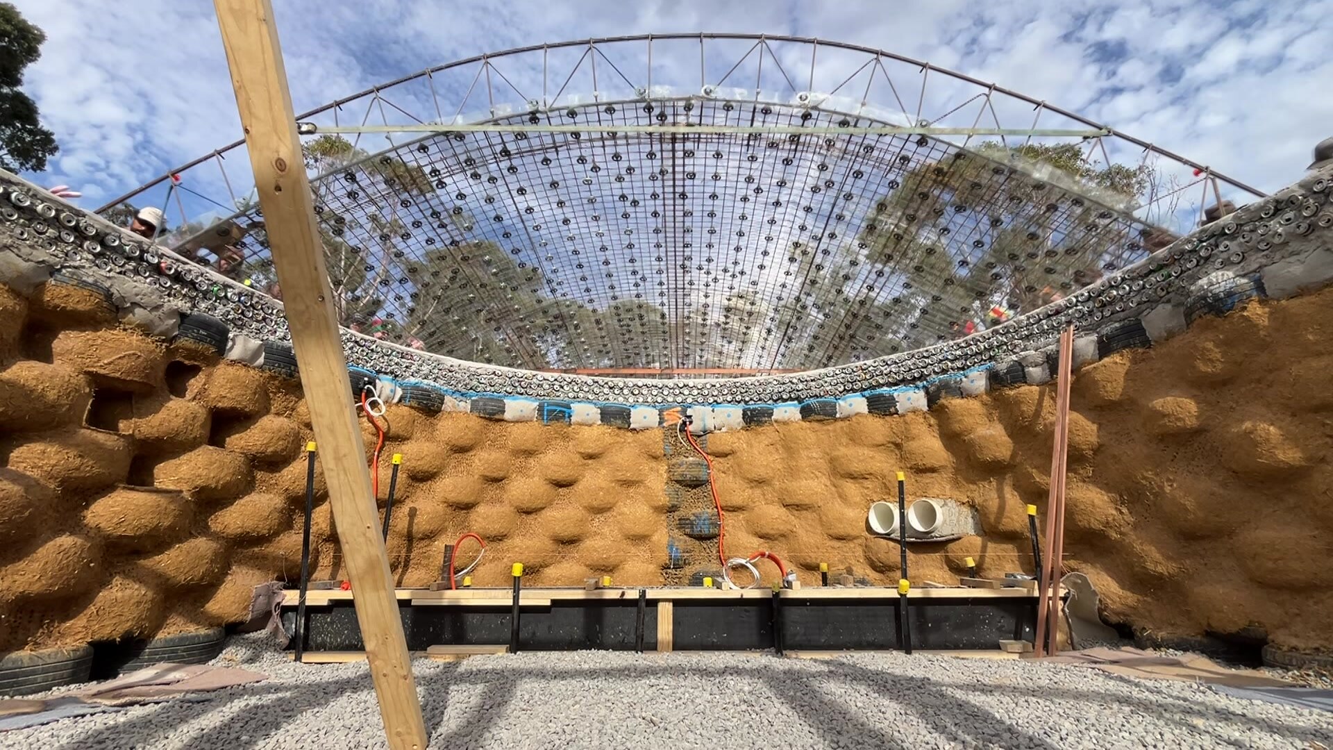 Home destroyed by fire rebuilt as an Earthship made of tyres, bottles ...