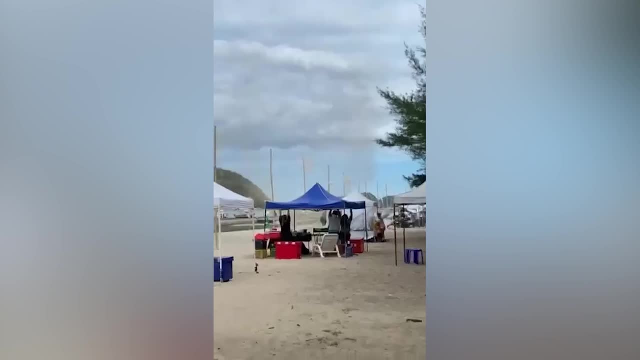 Dust devil rips through tents at Thai beach