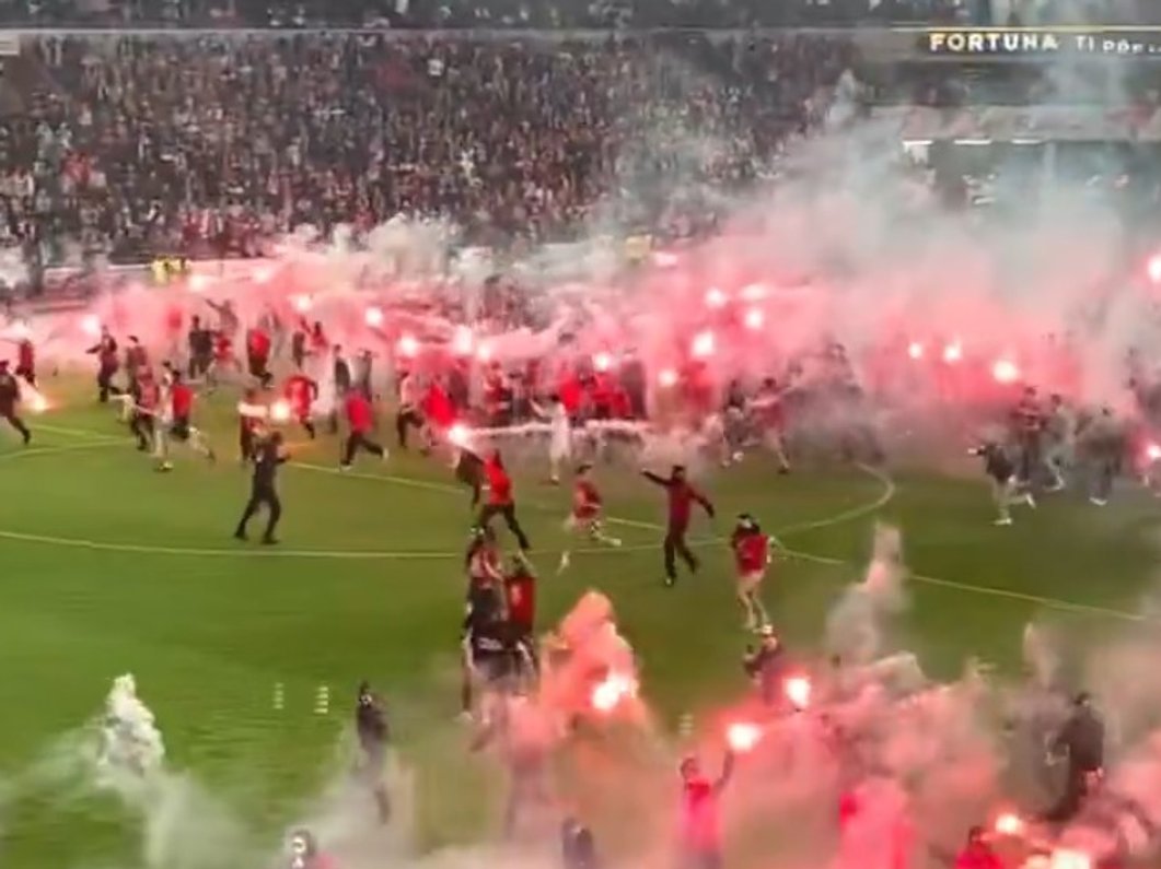 Pyro madness: Crazed fans storm soccer field