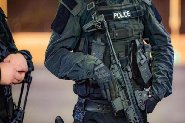 Two men arrested by armed police after men seen fighting with knife and axe