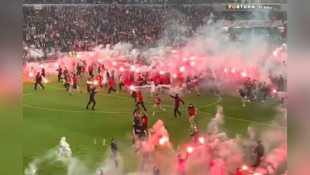 Pyro madness: Crazed fans storm soccer field