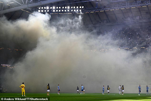 Fire breaks out next to fans at 50,000-seater football stadium during ...