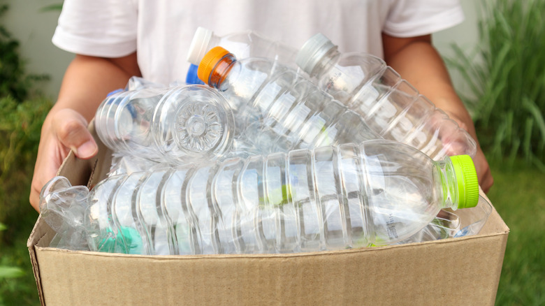 Upcycle plastic bottles into hanging planters for your home & garden