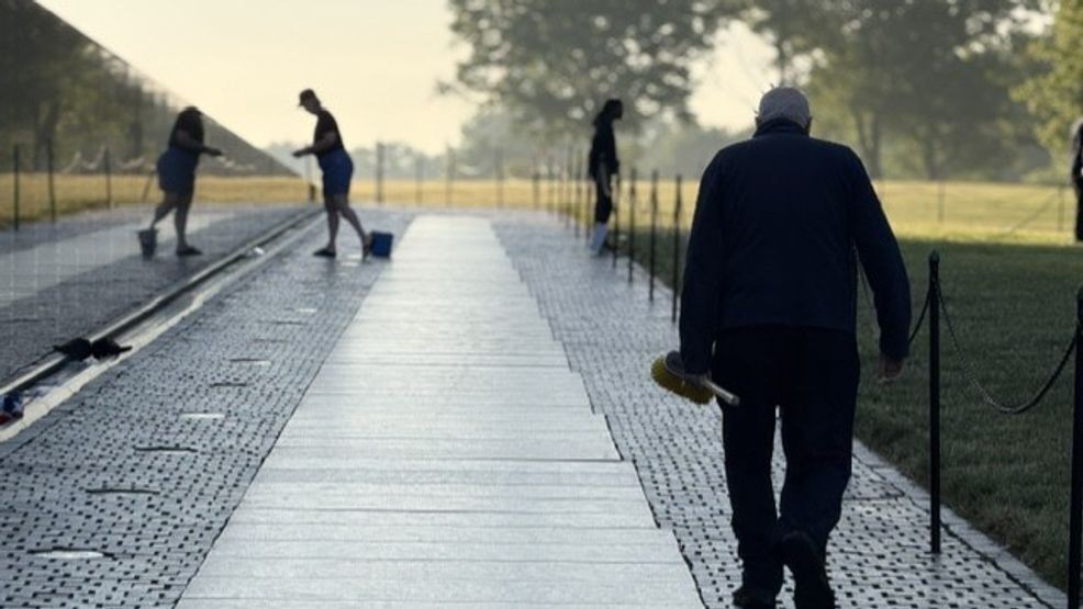 Photos | Volunteers wash Vietnam Veterans Memorial on Mother's Day in DC