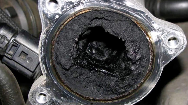 What parts of the engine are the most prone to carbon buildup?