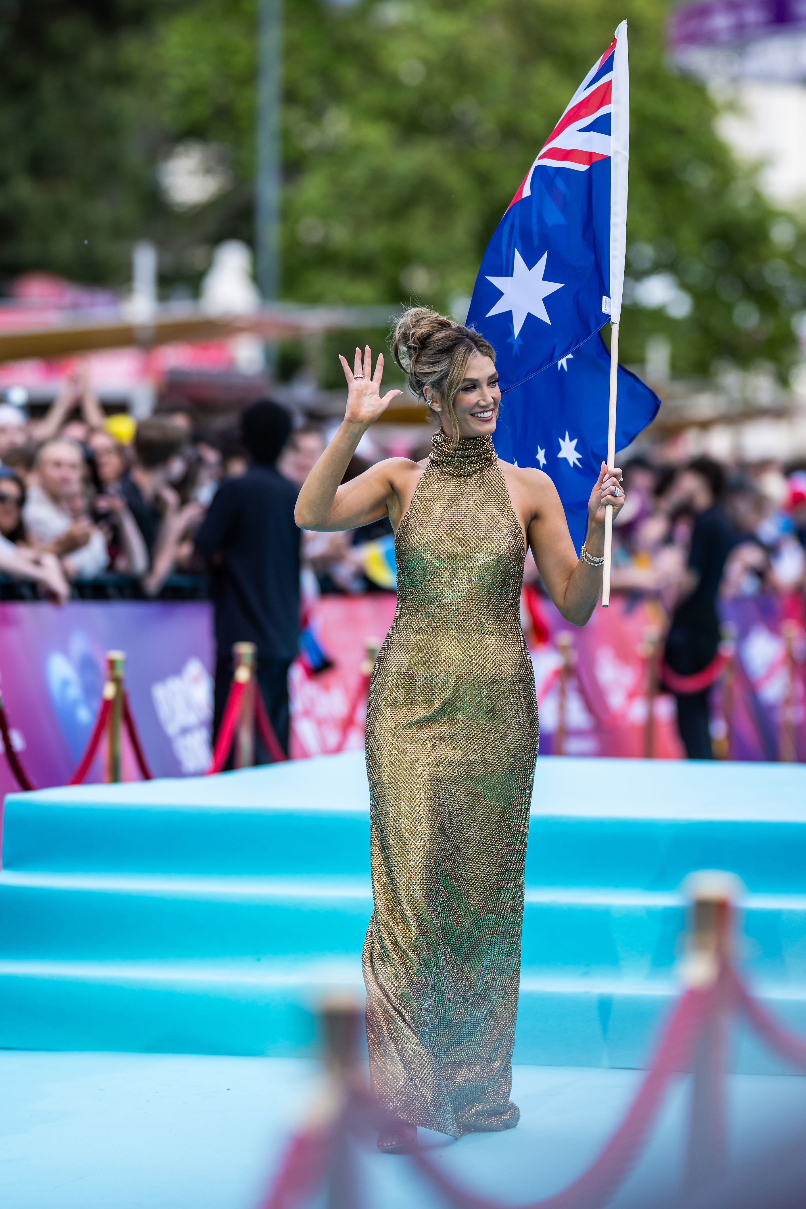Delta Goodrem glimmers in gold mesh dress at the Eurovision 2026 ...