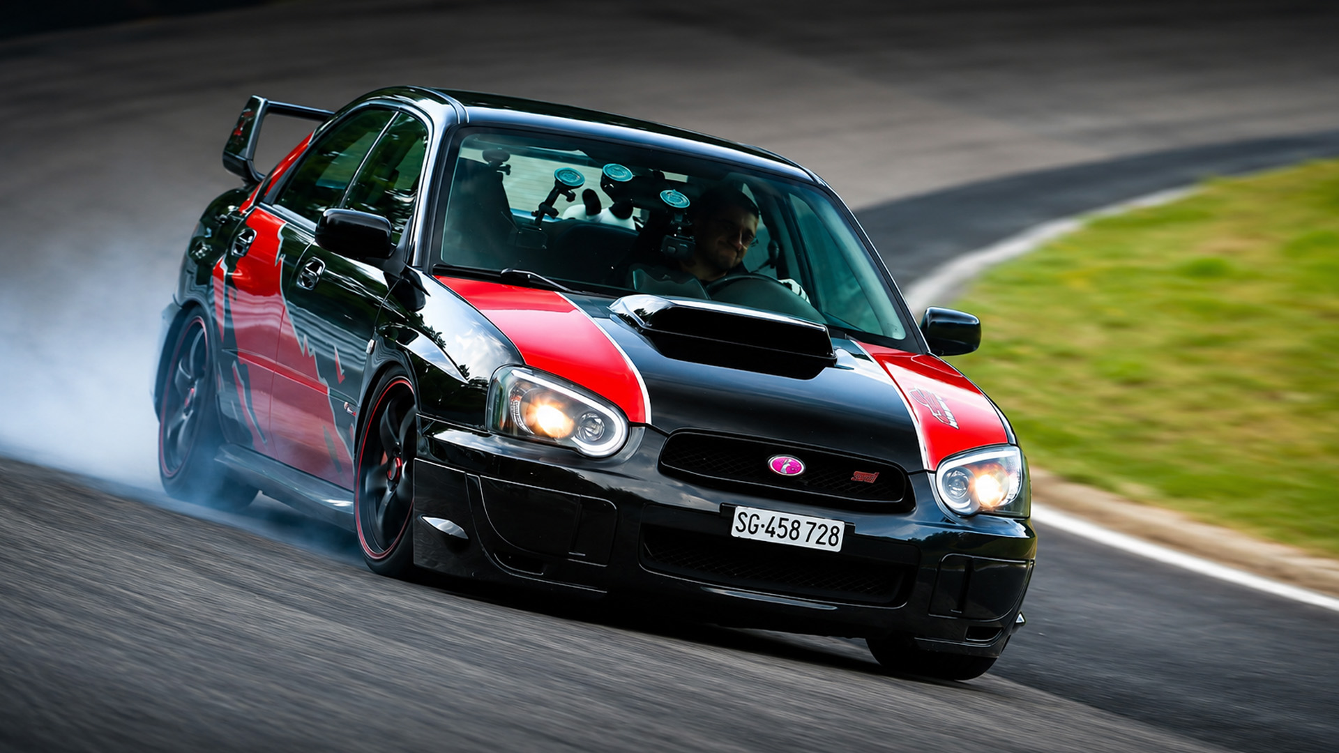 Subaru WRX STI nearly slips on track corner