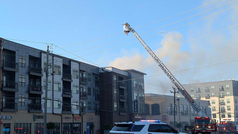 Road closed as crews battle fire at Chamblee complex