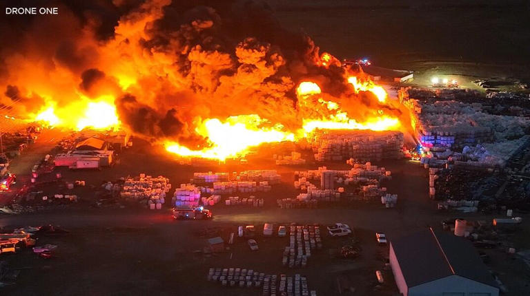 Fire burns at Pallet Green Recycling storage yard in rural Williston