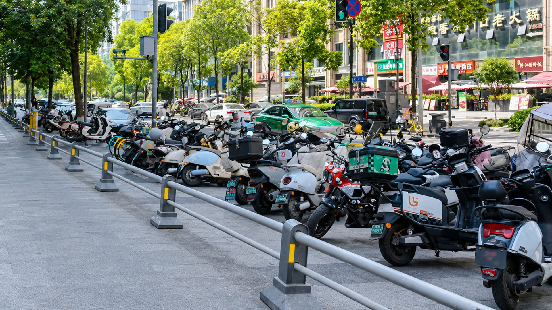 A street in China filled with electric scooters and green urban design