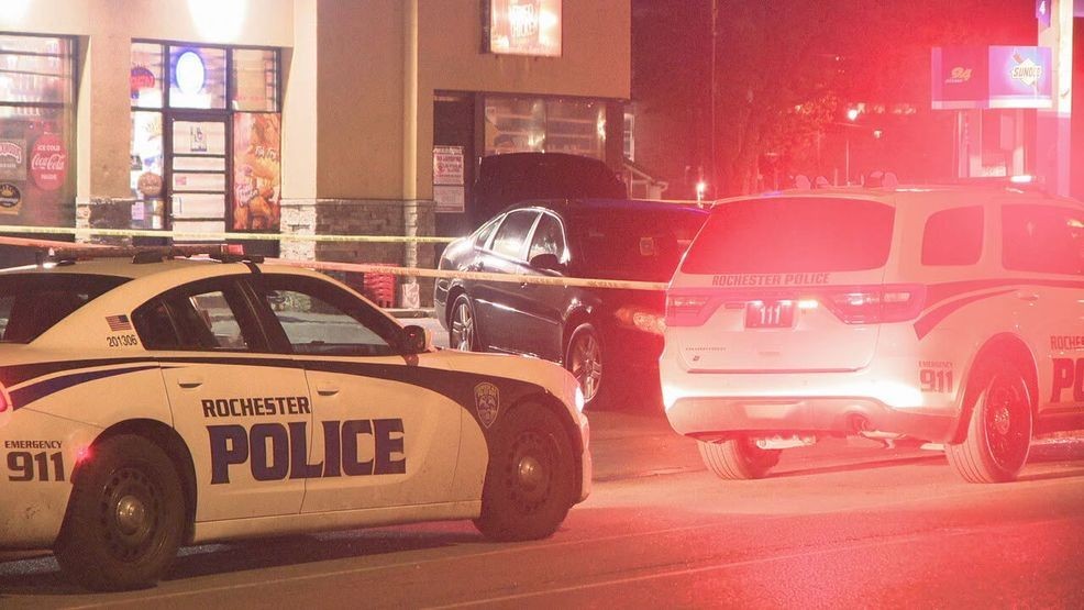 Woman pinned under car after lying in parking lot; driver charged