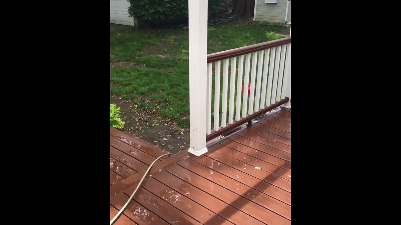 Deep cleaning outdoor deck with surface washer producing fresh wood look