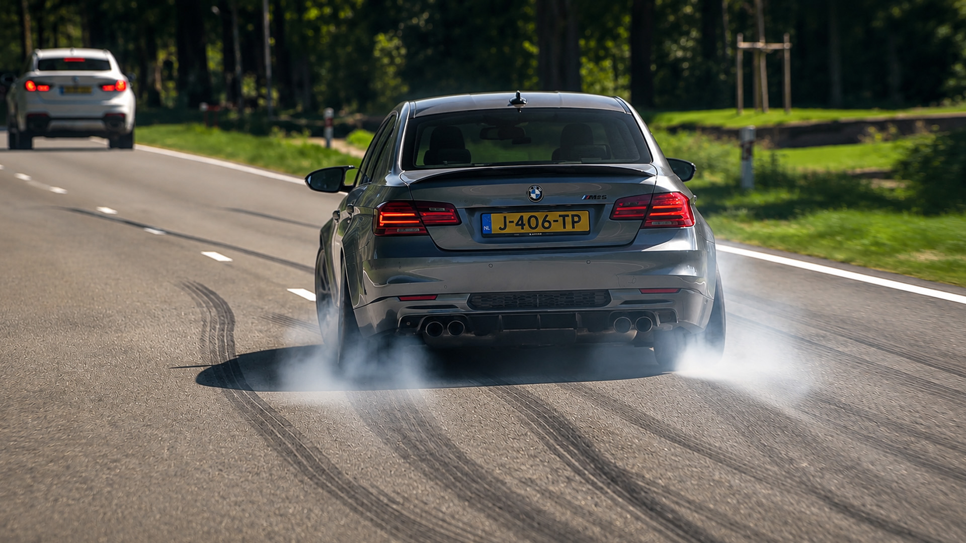BMW M3 almost spins during hard acceleration on public road