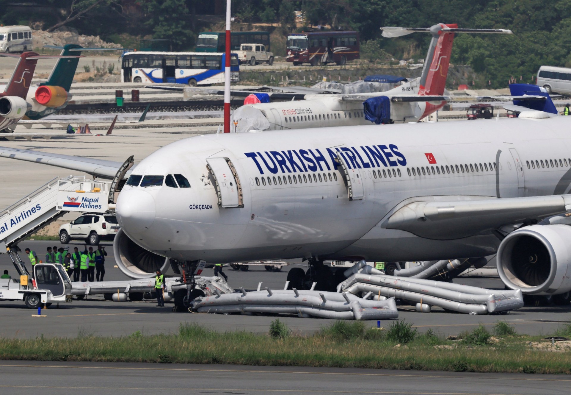 Turkish Airlines flight with 288 people on board catches fire as it lands
