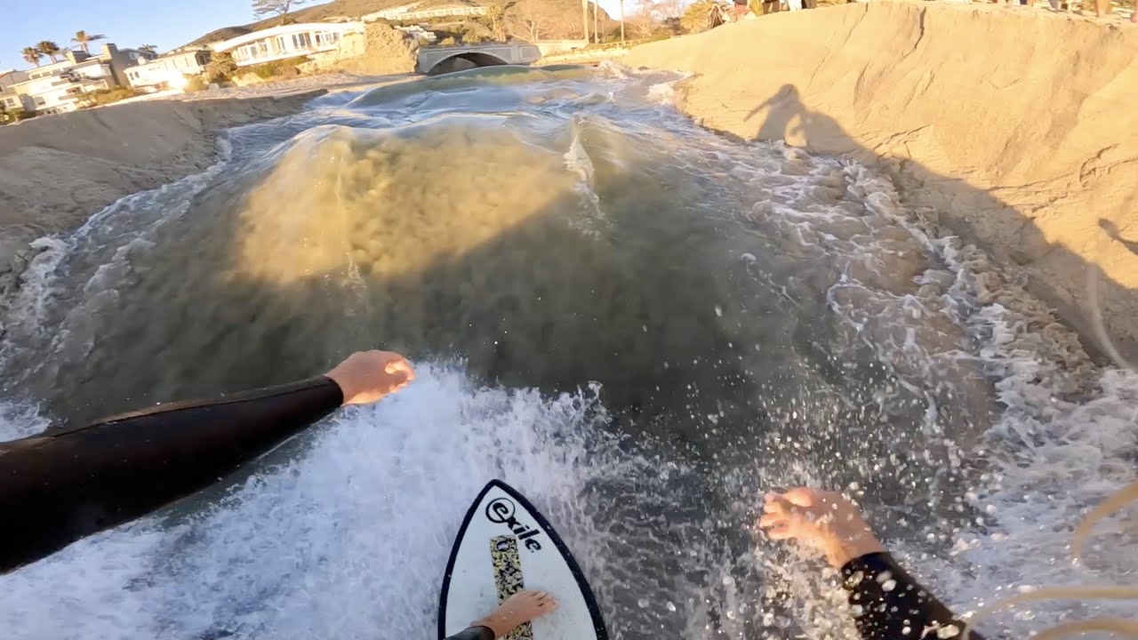 POV surfing a river wave