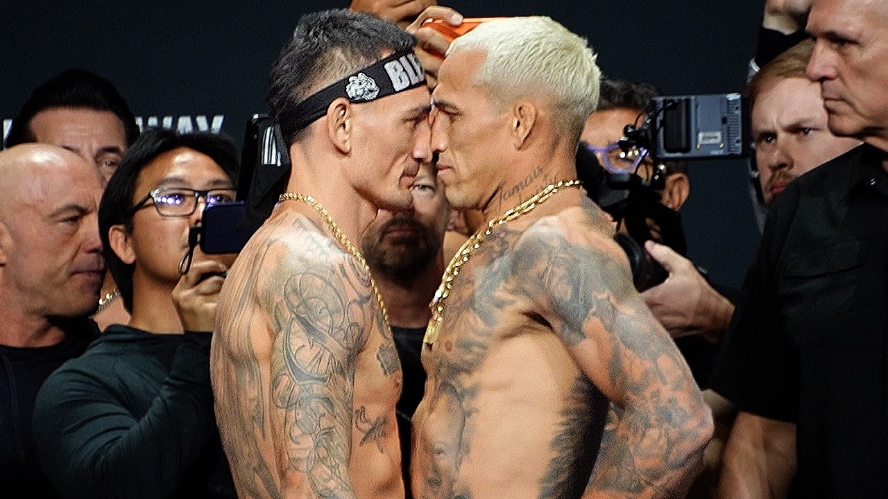 Max Holloway confronts Charles Oliveira during heated UFC 326 weigh-in