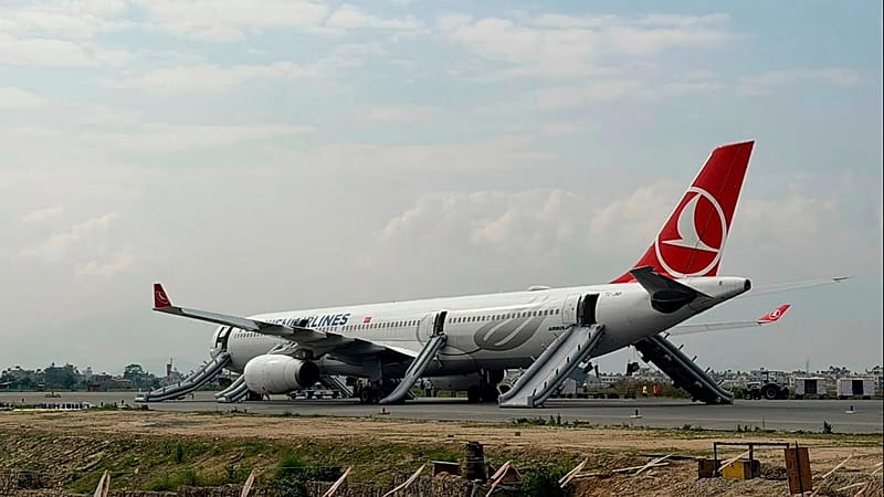 Turkish Airlines plane evacuated after landing gear fire in Nepal ...