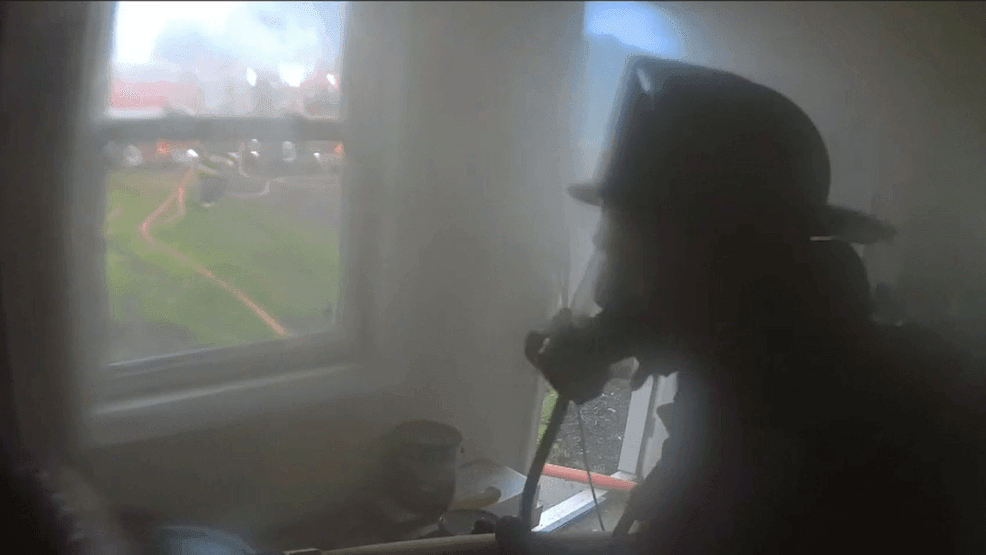 Helmet camera captures dramatic moments after firefighter falls through ...