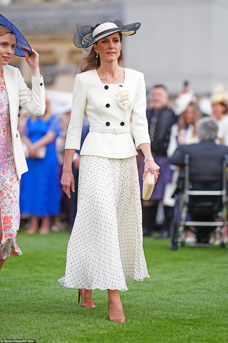 Kate impresses royal fans as she walks across the grass in stilettos