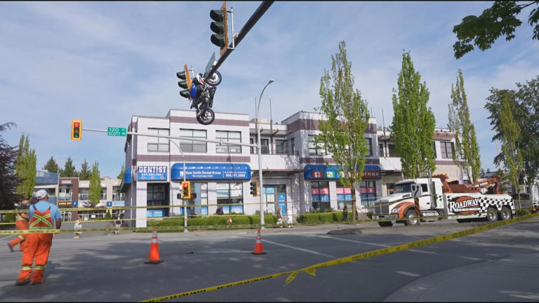 Motorcyclist seriously injured after crash leaves bike dangling from ...