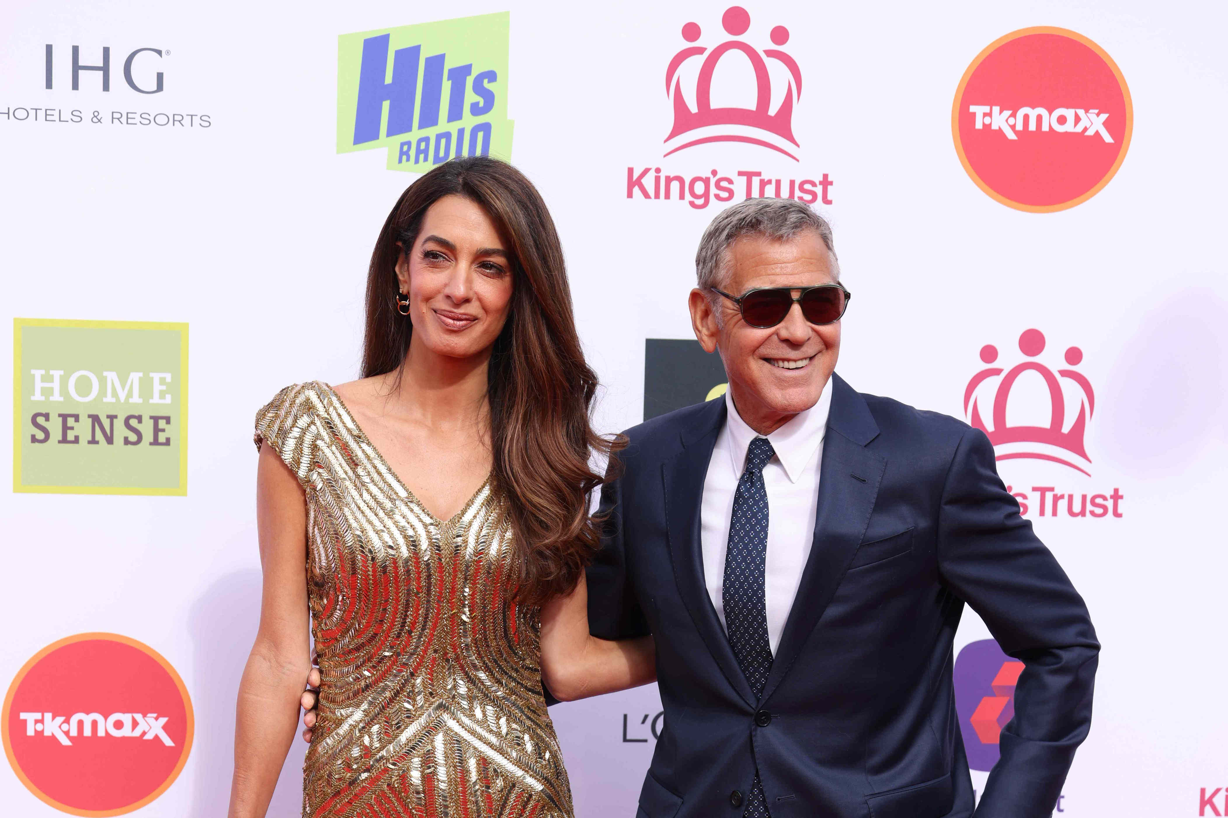 Amal Clooney shimmers in a Gatsby-coded gilded gown for red carpet date ...