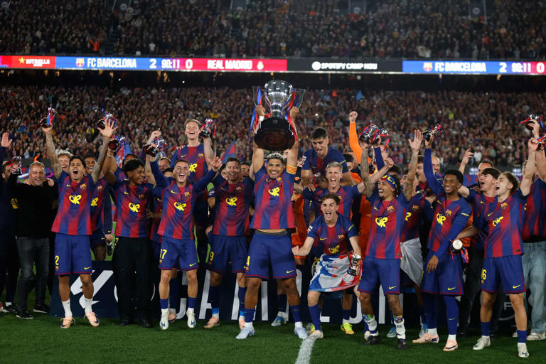 Watched by its grieving coach, Barcelona retains Spanish league title ...