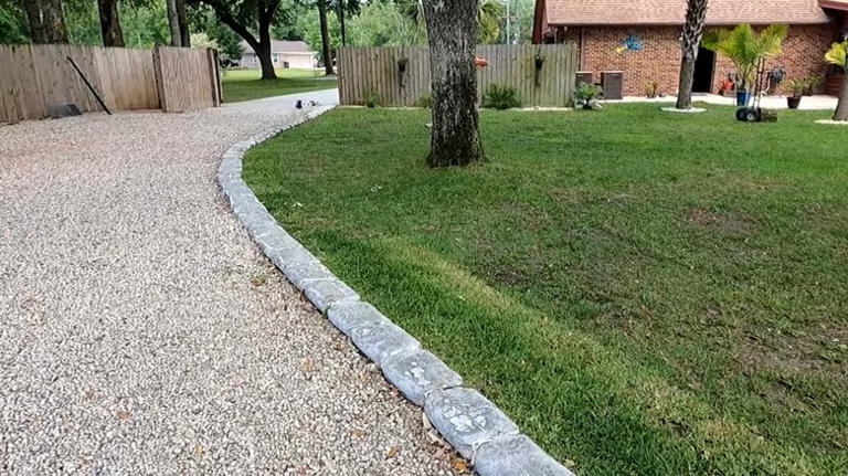 Give your driveway a polished edge with this easy concrete bag trick