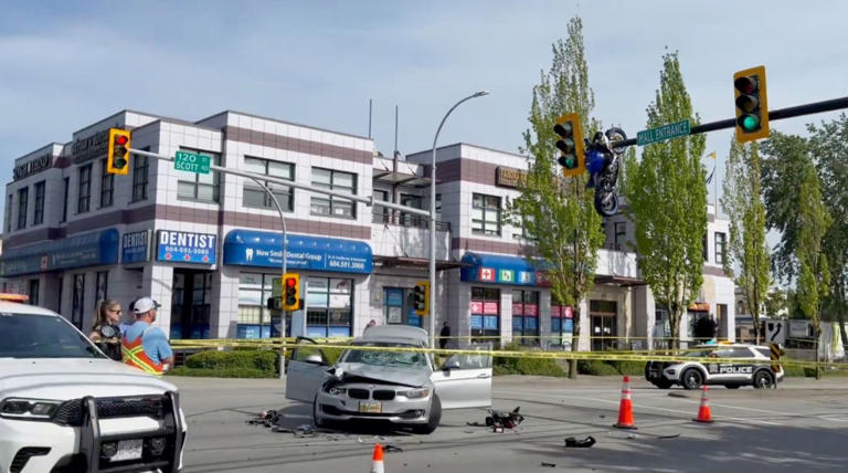 Motorcycle flies onto traffic light pole after head-on collision with ...