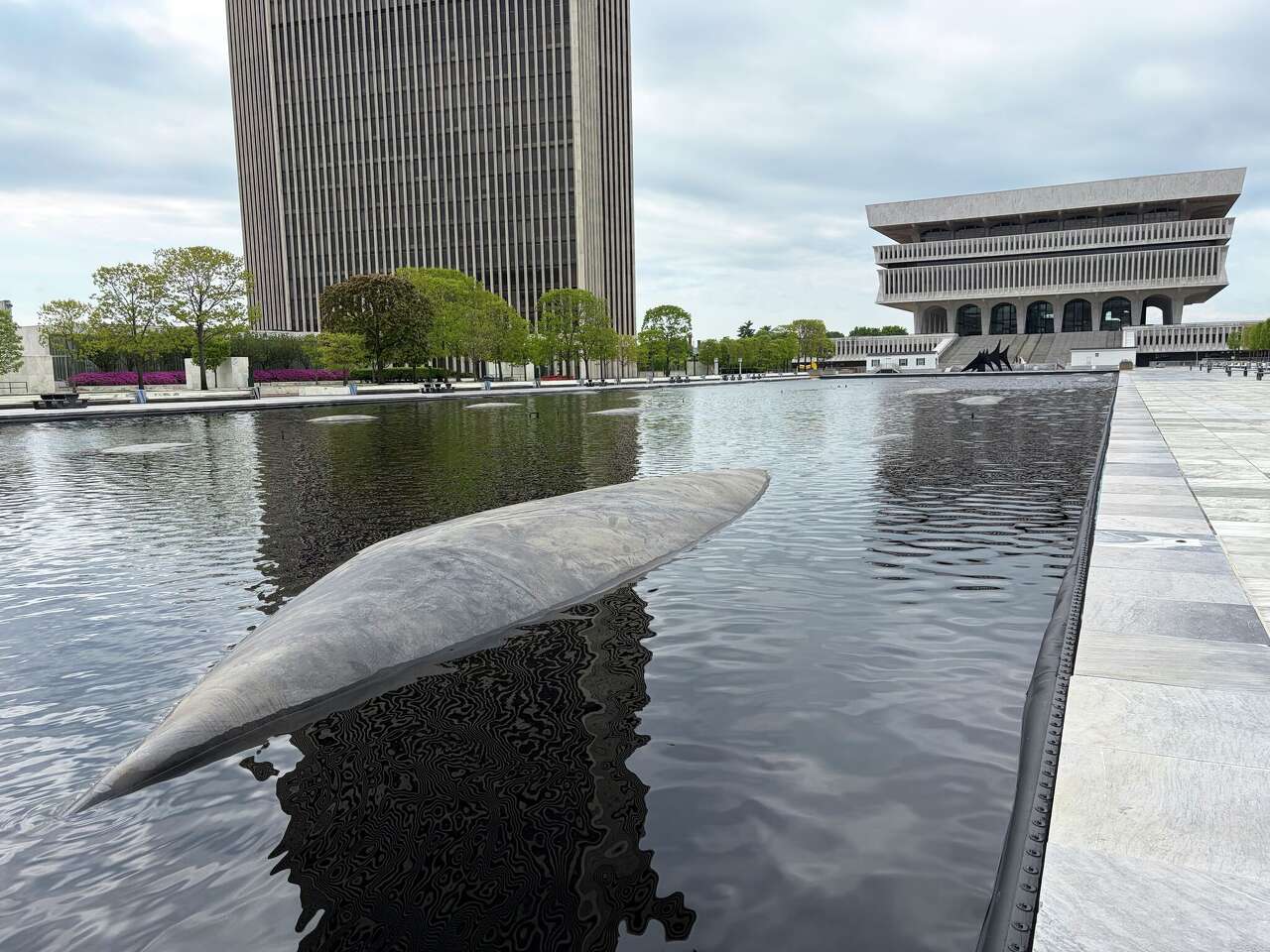 Giant air bubbles surface at Empire State Plaza reflecting pools