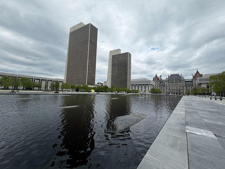 Giant air bubbles surface at Empire State Plaza reflecting pools