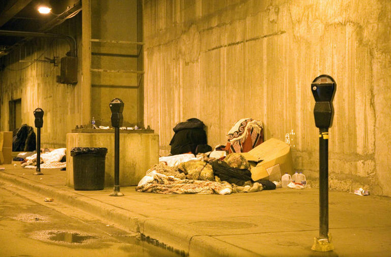 Mayor Tim Keller weighs in on proposed ban to sit, sleep or lie on ...