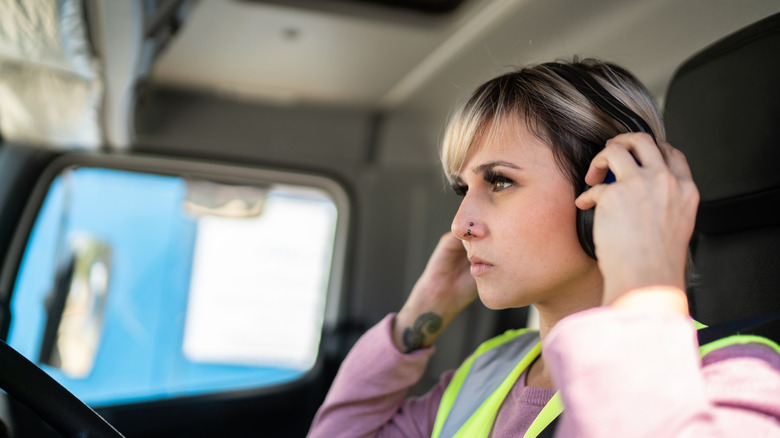 The reason why you always see truckers wearing headsets