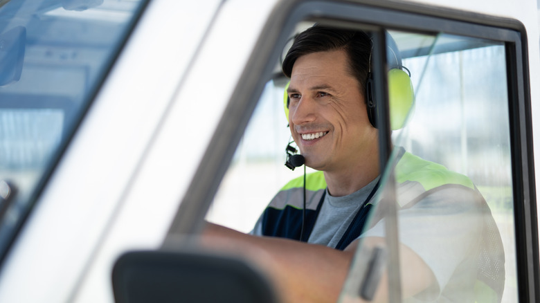 The reason why you always see truckers wearing headsets