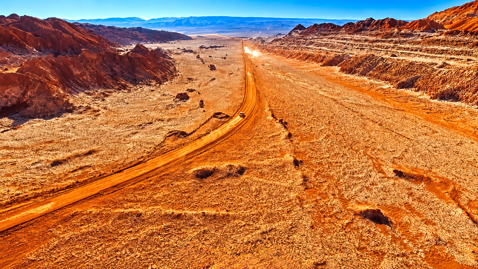 Red Earth mountains rising across an otherworldly desert