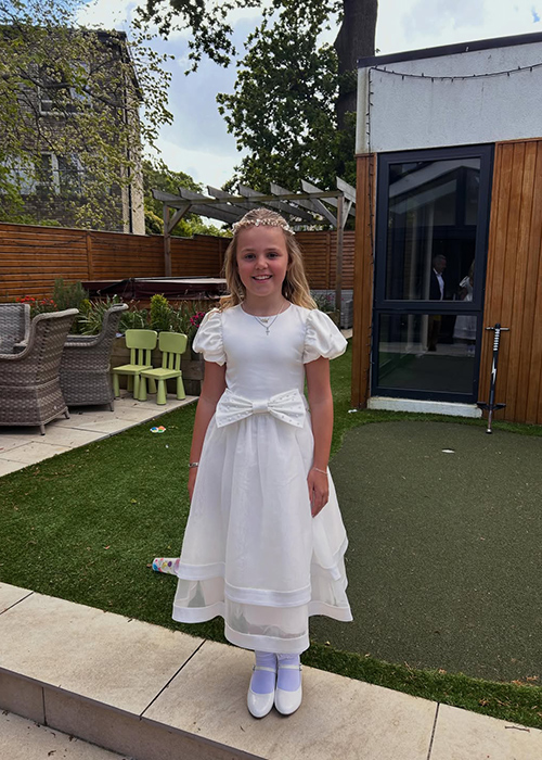Jacqui Hurley dusts off pretty purple dress for daughter's communion