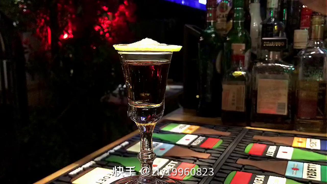 Creating fire topped Nikolashka drink with glowing flame and elegant ...